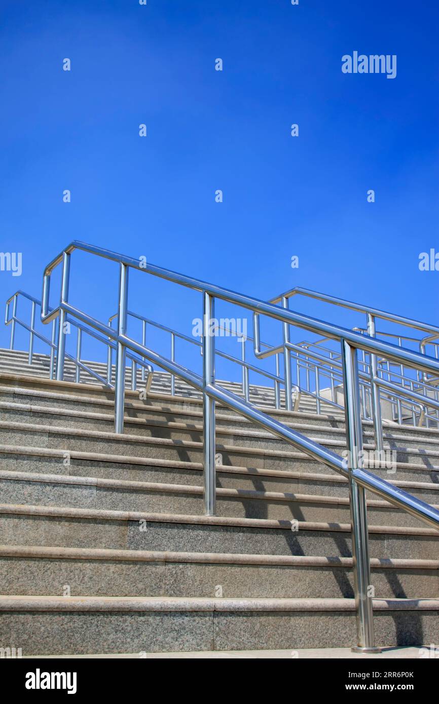 Stainless steel handrails and steps in a building Stock Photo - Alamy