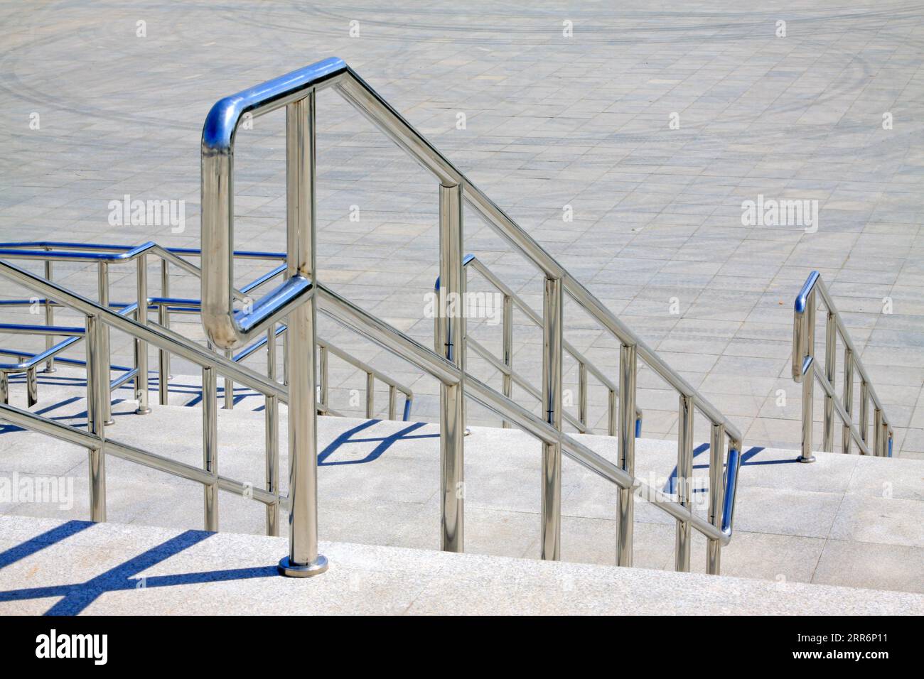 Stainless steel handrails and steps in a building Stock Photo - Alamy