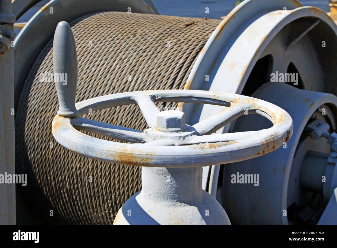 Wire rope and wheel handle, closeup of photo Stock Photo - Alamy