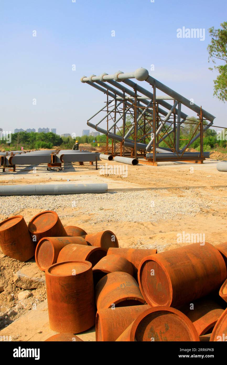 Gray steel structure and oxidation rust cylinder, closeup of photo ...