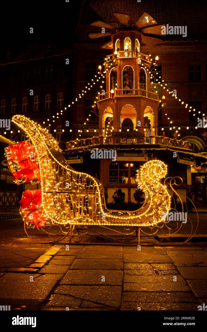 Santa Claus Sleigh Holiday Decorated and illuminated street at night in ...