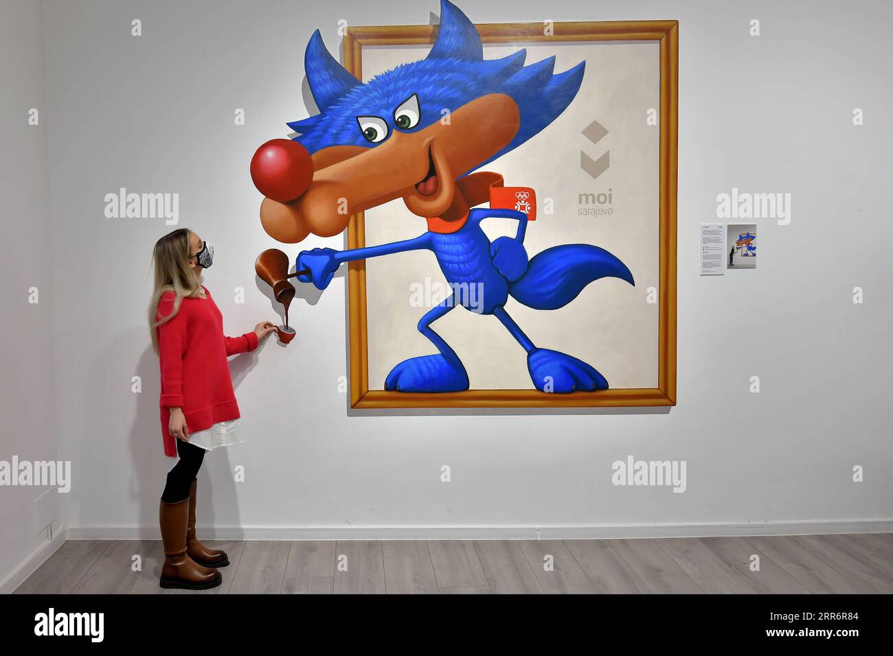 210225 -- SARAJEVO, Feb. 25, 2021 -- A woman poses for a photo next to ...