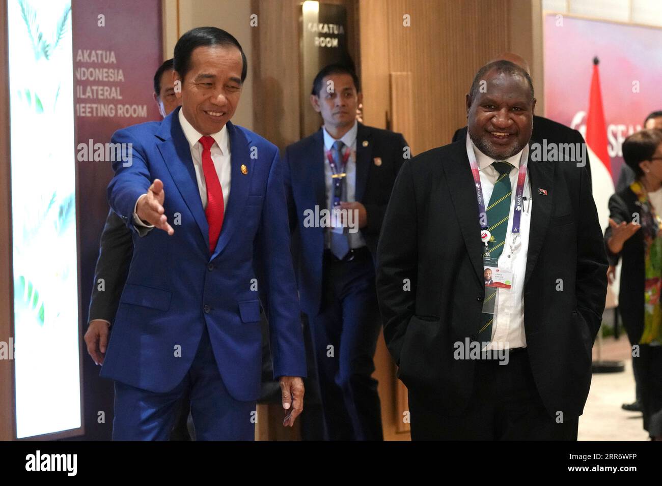 Indonesian President Joko Widodo, left, walks with Papua New Guinea's ...