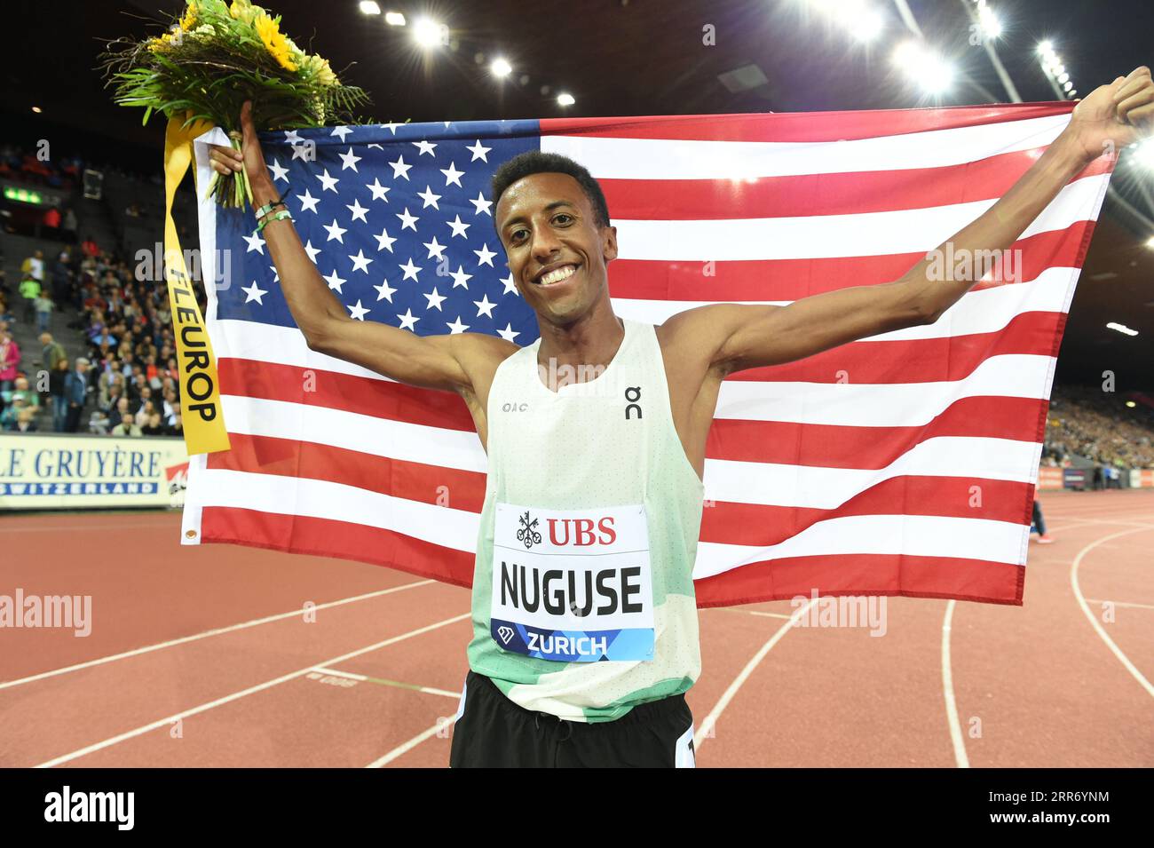 Yared Nuguse (USA) poses with United States flag after winning the 1 ...