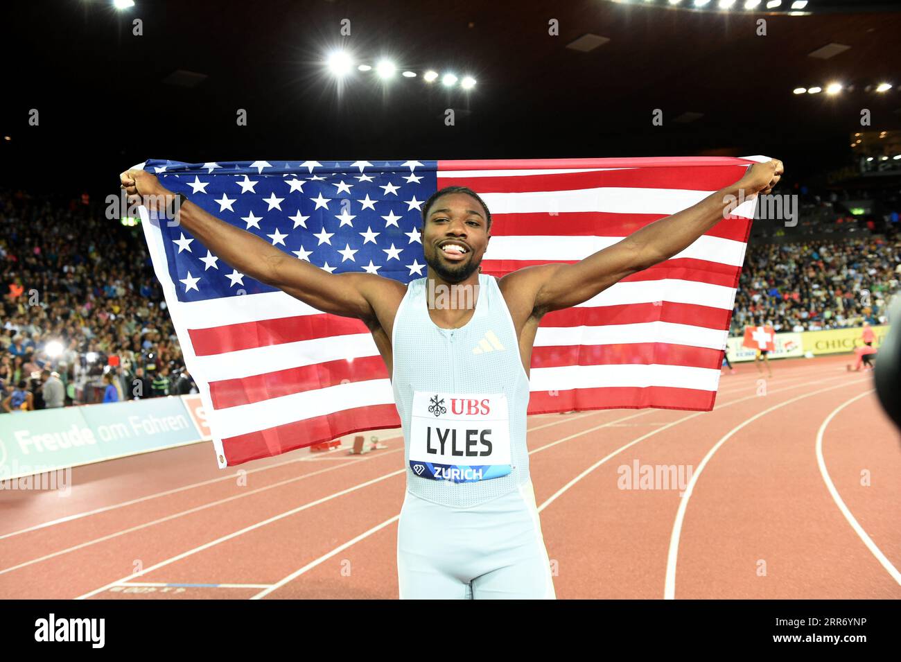 Noah Lyles (USA) poses with United States flag after winning the 200m ...