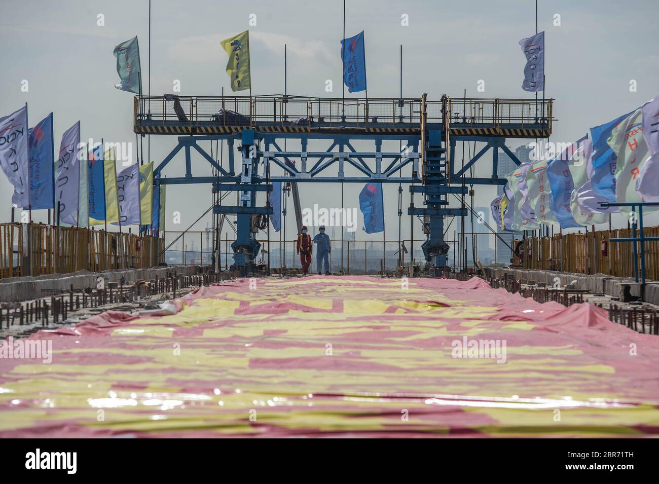 210308 -- JAKARTA, March 8, 2021 -- Workers are seen on the largest ...