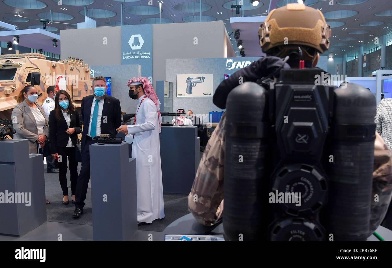 210315 -- DOHA, March 15, 2021 -- Visitors look at exhibits after the ...
