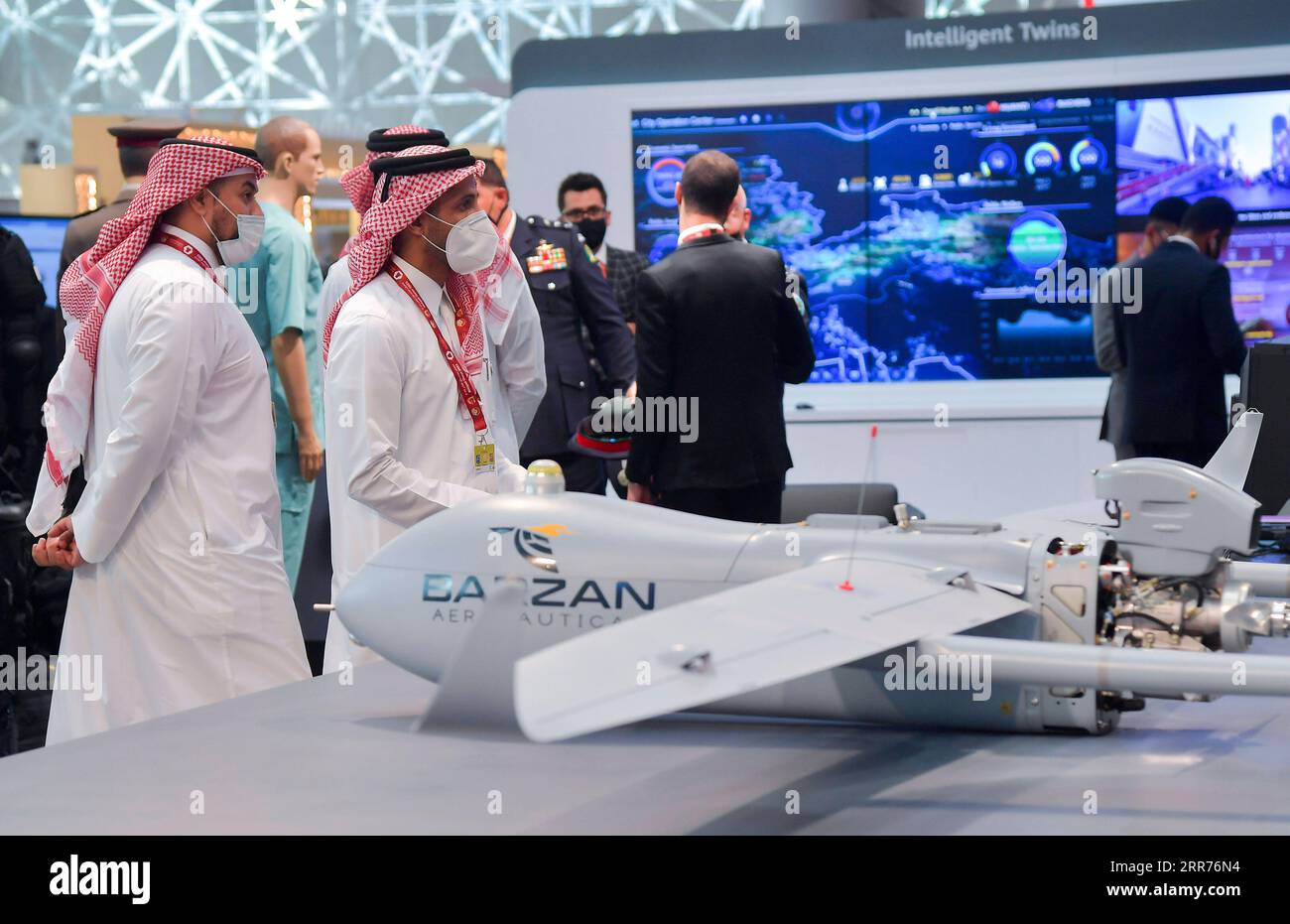 210315 -- DOHA, March 15, 2021 -- Visitors look at exhibits after the ...