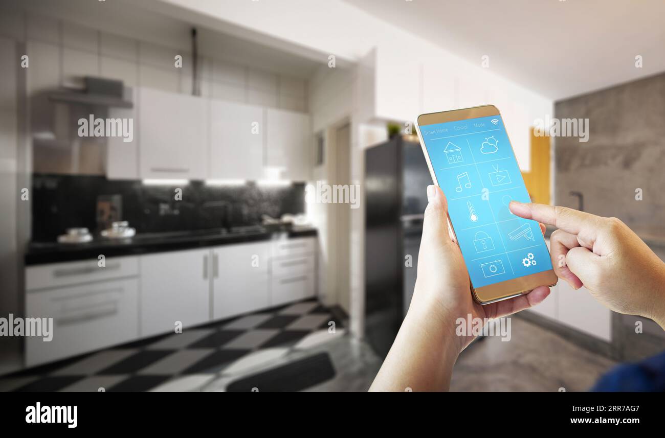Female hand is adjusting lighting with smart phone. Smart home control ...