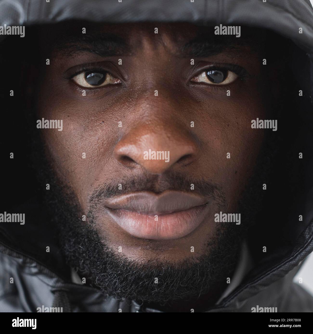 Close up man wearing hoodie Stock Photo - Alamy