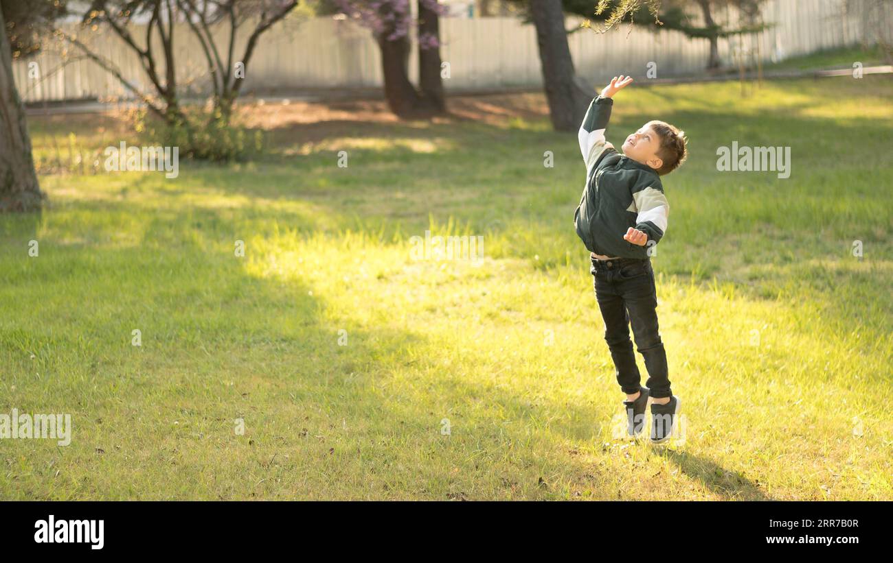 Little boy jumping Stock Photo - Alamy
