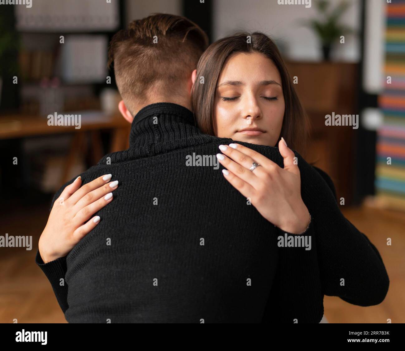 Medium shot people hugging Stock Photo - Alamy