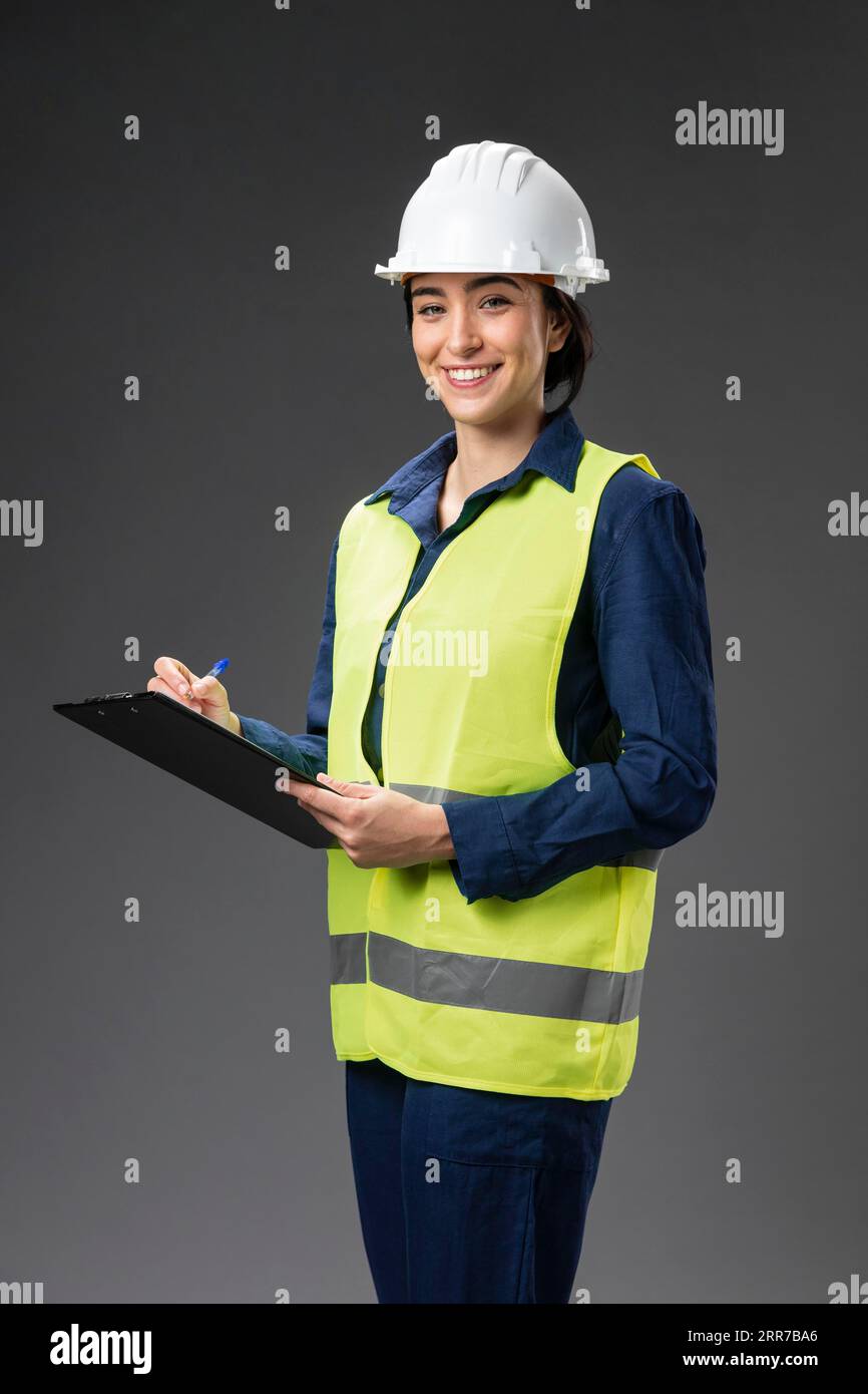 Portrait female engineer with clipboard 2 Stock Photo - Alamy