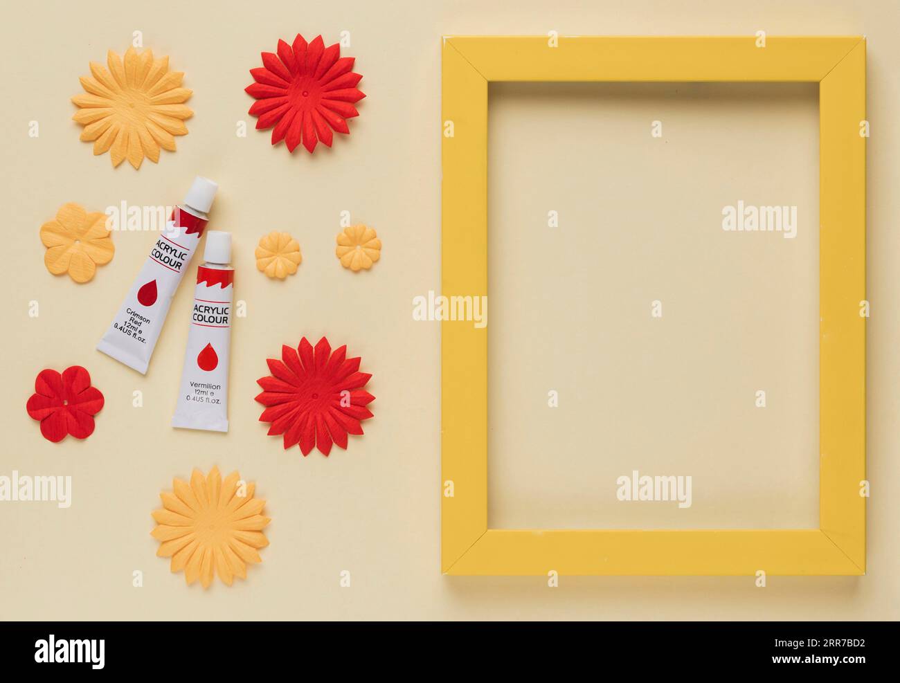 Paint tube flower cutout yellow wooden frame border beige background ...