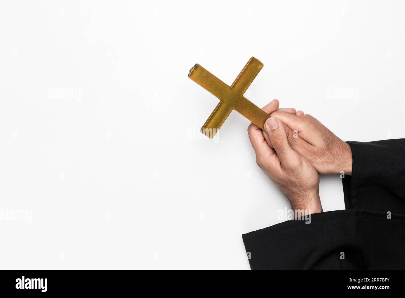 Priest holding holy cross hands Stock Photo - Alamy