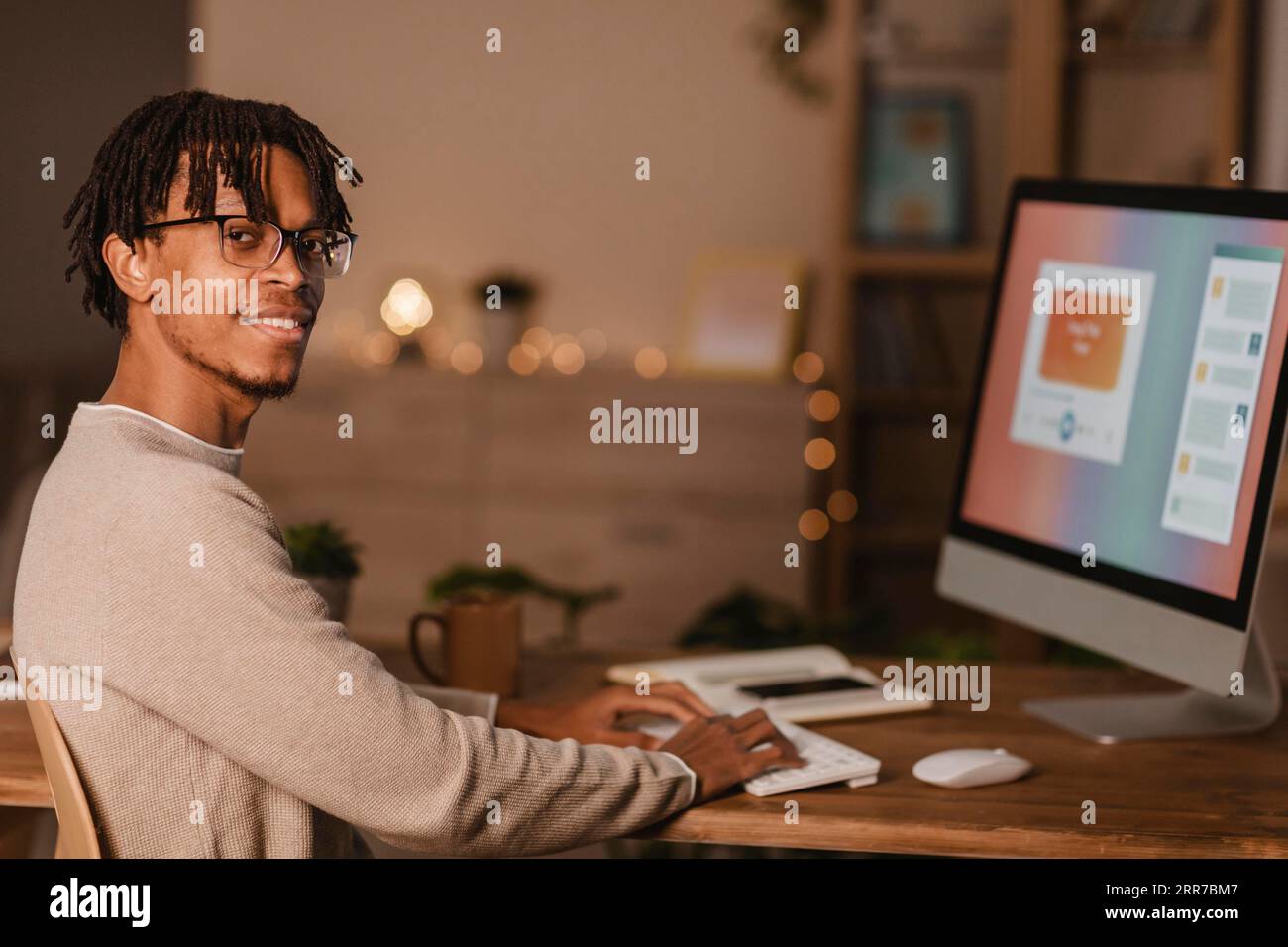 Side view man using personal computer home Stock Photo - Alamy