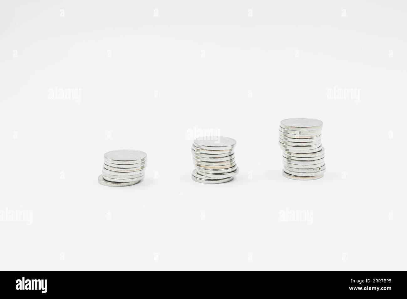 Stack silver coins Stock Photo - Alamy
