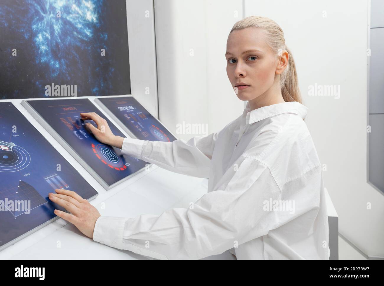 Side view woman working digital monitors Stock Photo - Alamy