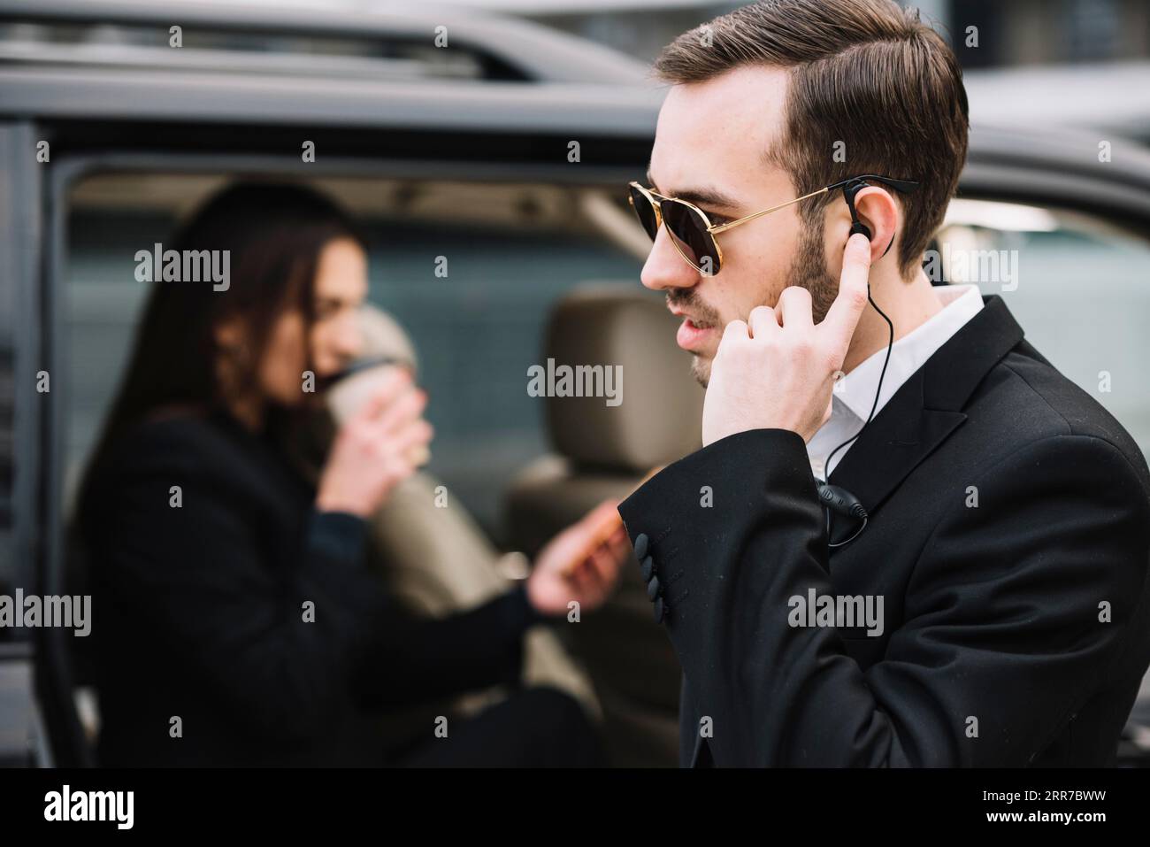 Side view security man checking area Stock Photo - Alamy