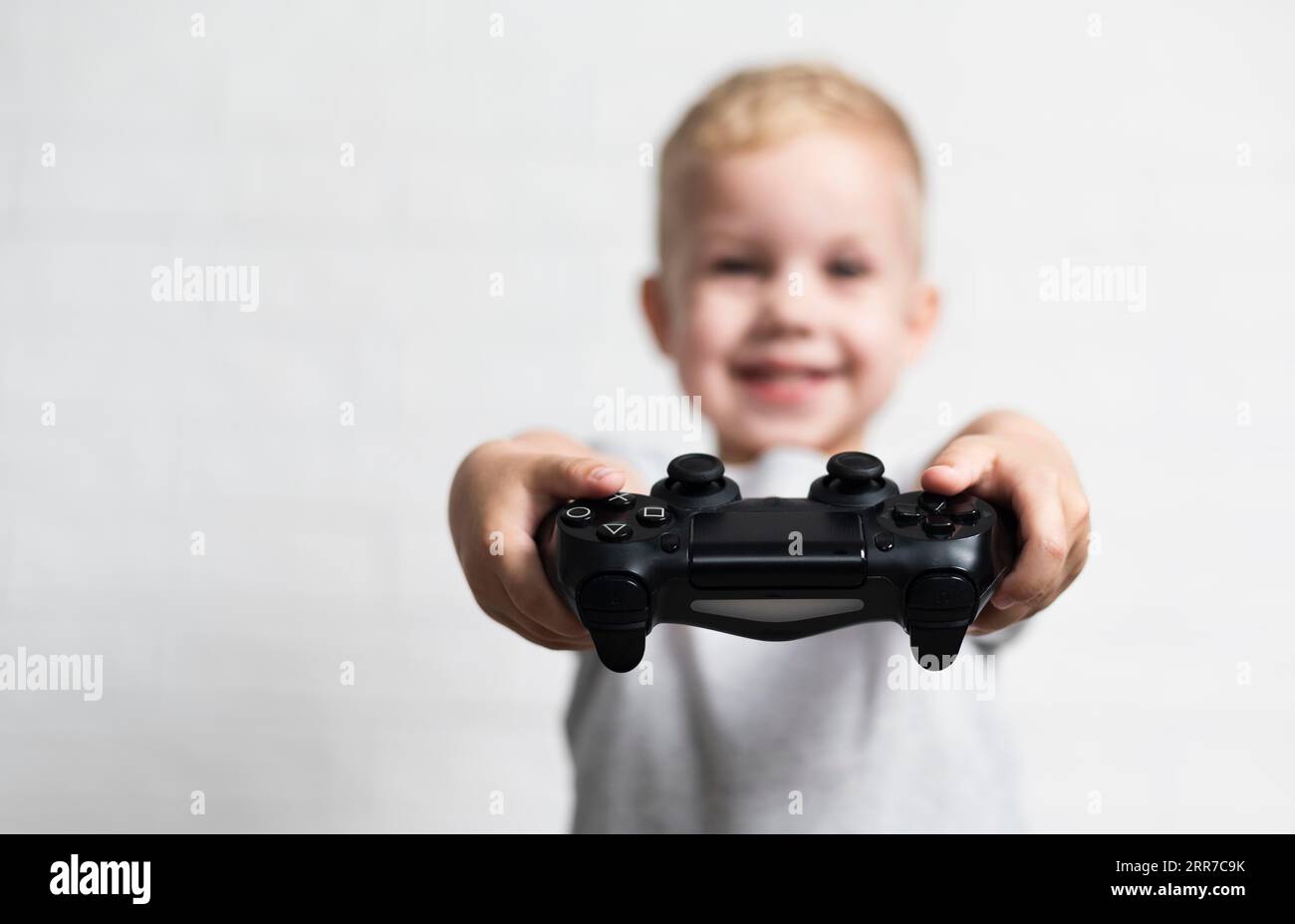 Boy with controller hi-res stock photography and images - Alamy