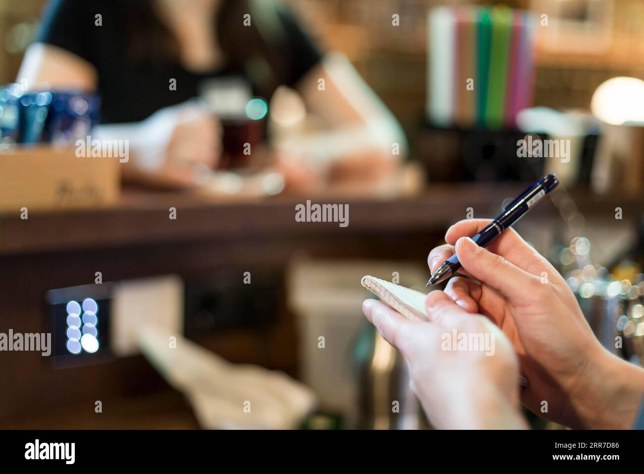 Crop hands taking order Stock Photo - Alamy