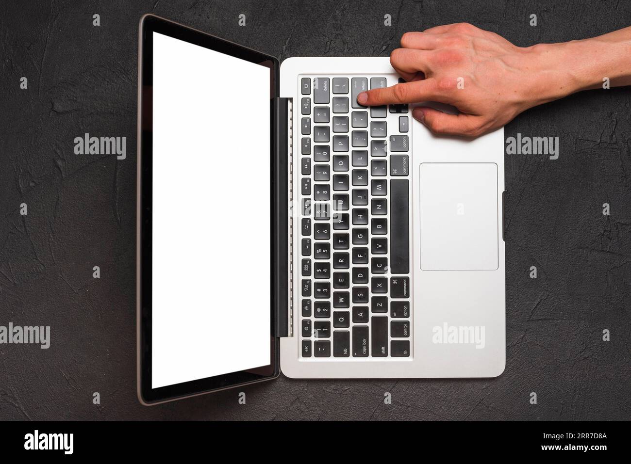 Elevated view person s hand using laptop black background Stock Photo ...