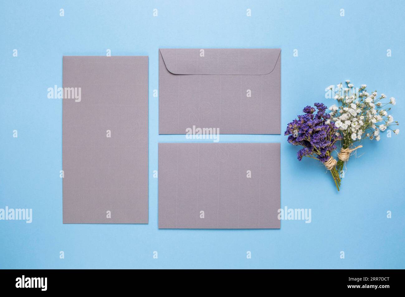 Flat lay grey wedding invitation Stock Photo - Alamy