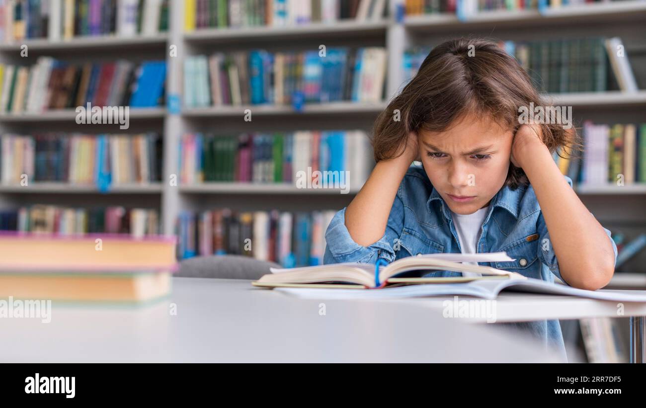 Boy thinking hard about how solve his homework with Stock Photo - Alamy