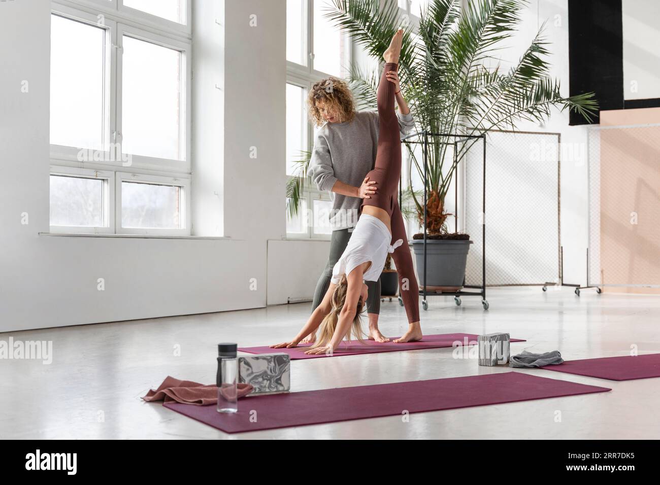 Male coach helping woman hi-res stock photography and images - Alamy