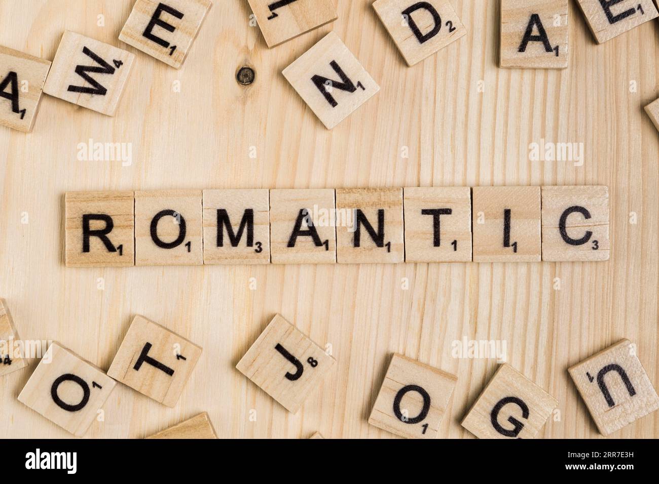 Romantic word wooden tiles Stock Photo - Alamy