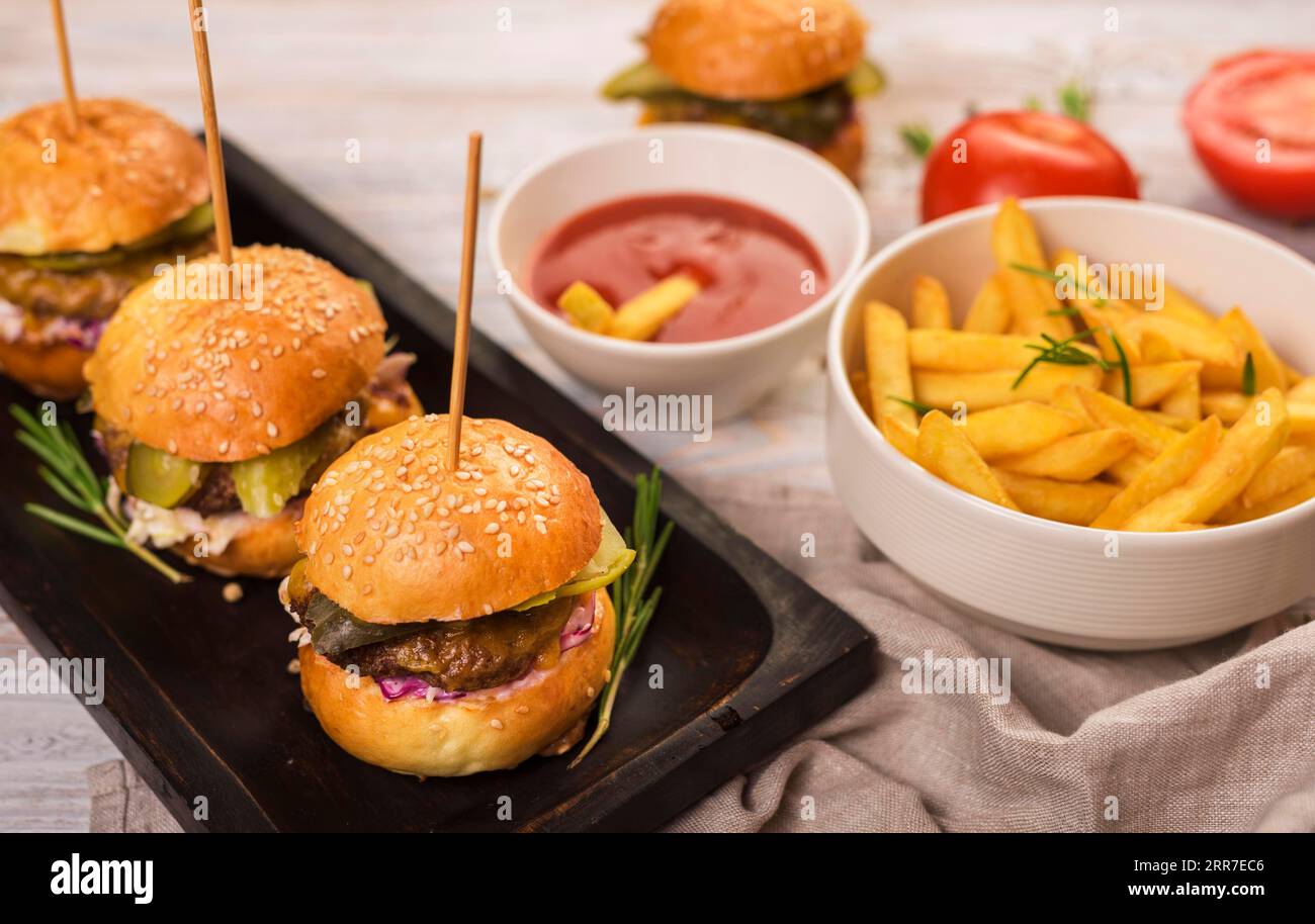 Tasty fast food snacks ready be served Stock Photo - Alamy