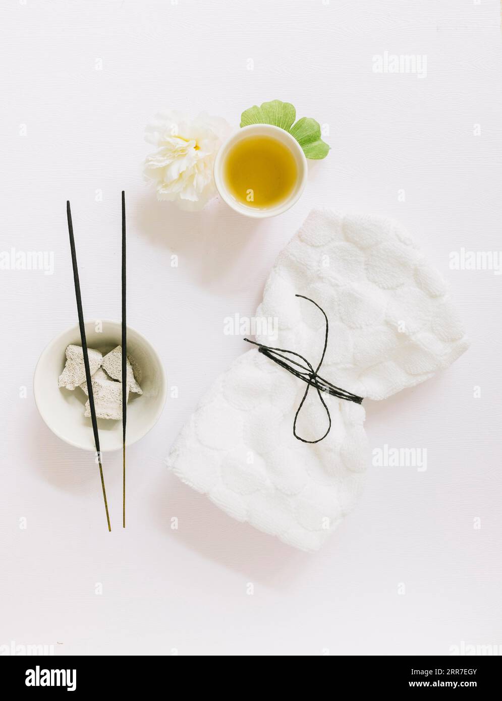 Top view incense stick pumice stone flower gingko leaf oil tied napkin ...