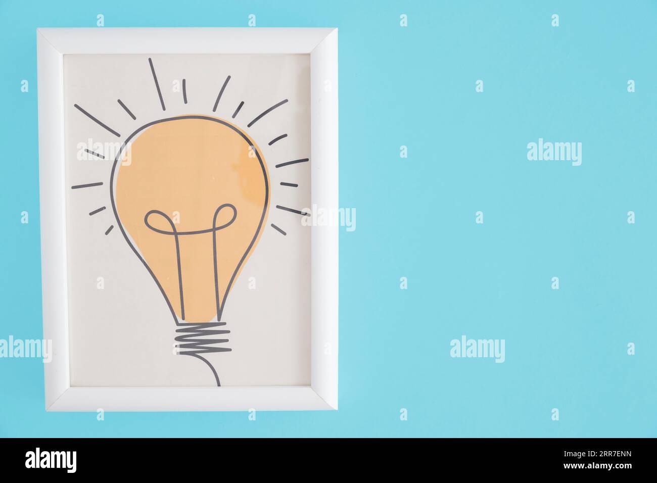 Yellow hand drawn light bulb white frame blue background Stock Photo ...