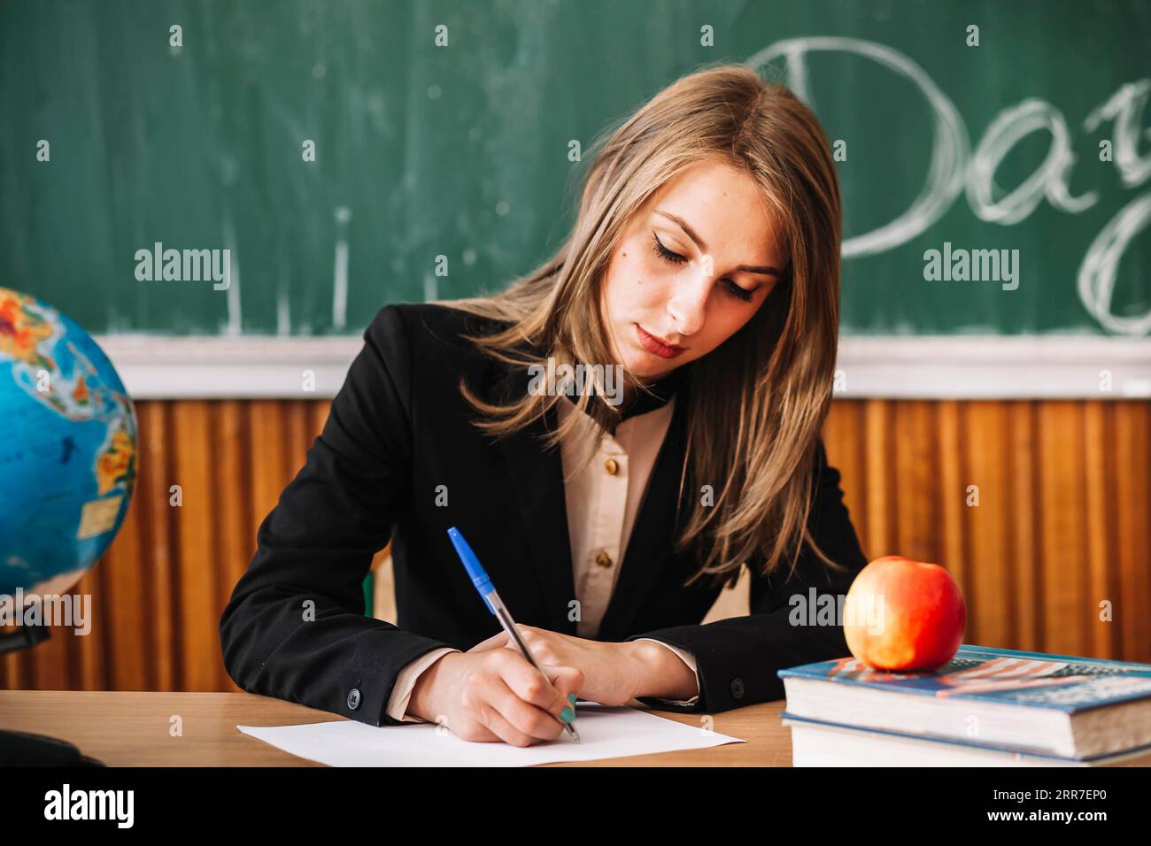 Young teacher working class Stock Photo - Alamy