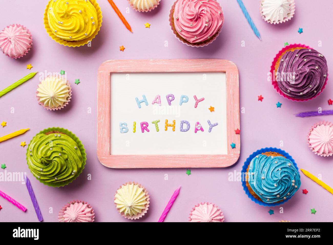 Wooden happy birthday white slate surrounded with muffins aalaw candles ...