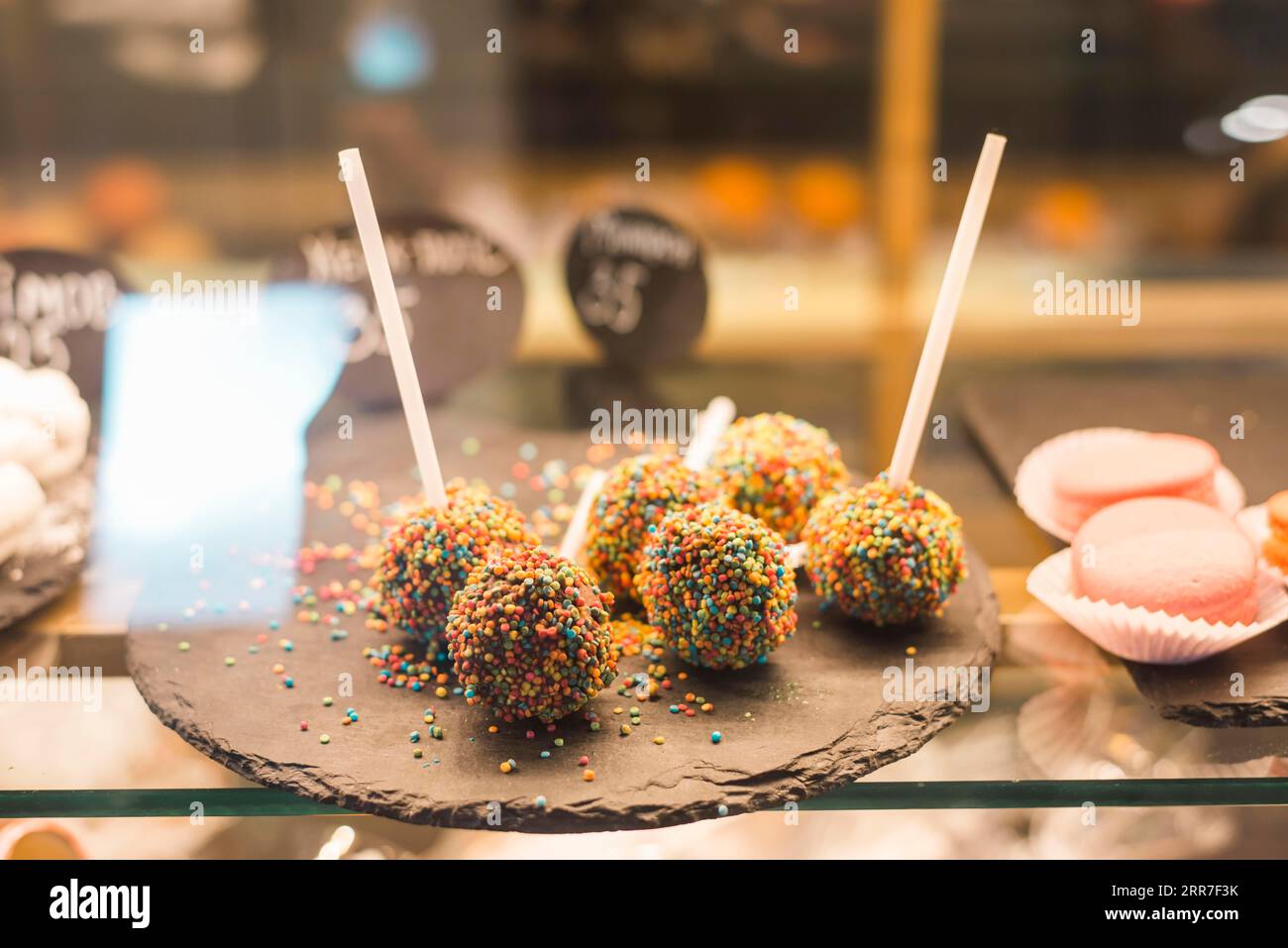 Chocolate cake pops with colorful sprinkles display cabinet Stock Photo ...