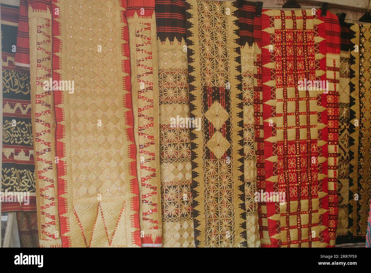 Fabric Various motifs. different fabrics displayed on the shelves. a ...
