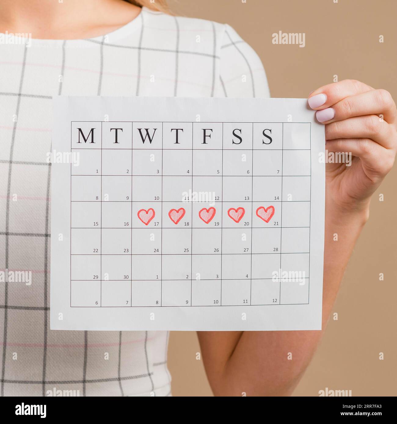Close up period calendar with drawn heart shapes Stock Photo - Alamy