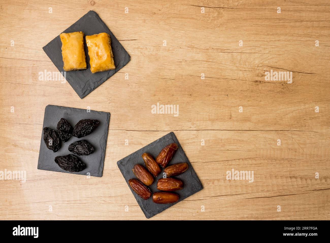 Different dried fruits with eastern sweets Stock Photo - Alamy