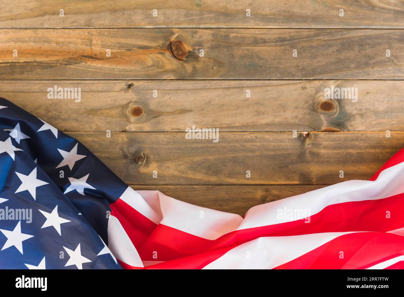 Fabric us flag wooden surface Stock Photo - Alamy