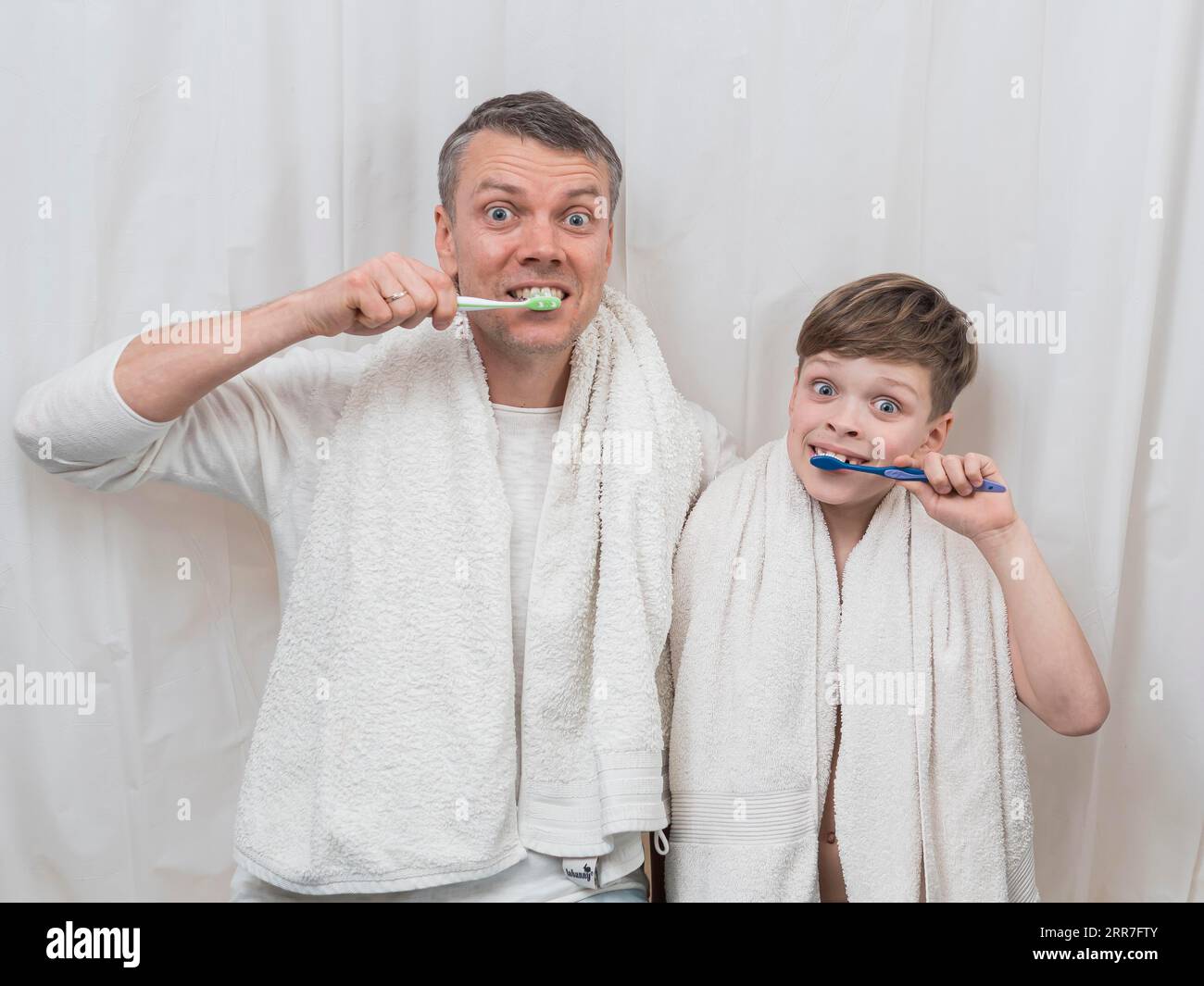 Father s day brushing teeth together Stock Photo - Alamy