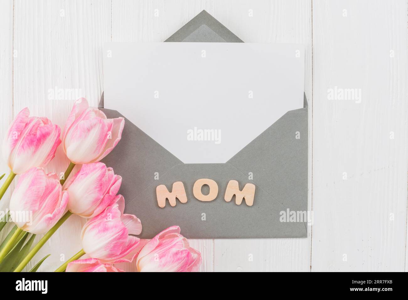Frame envelope with word mom tulips Stock Photo - Alamy