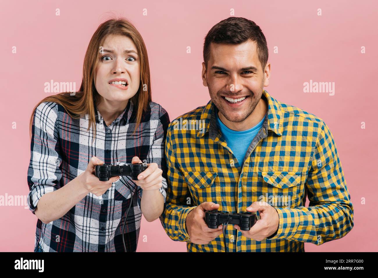 Front view best friends playing video games Stock Photo - Alamy