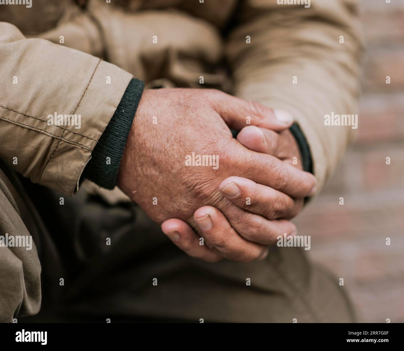 Front view homeless man hands Stock Photo - Alamy