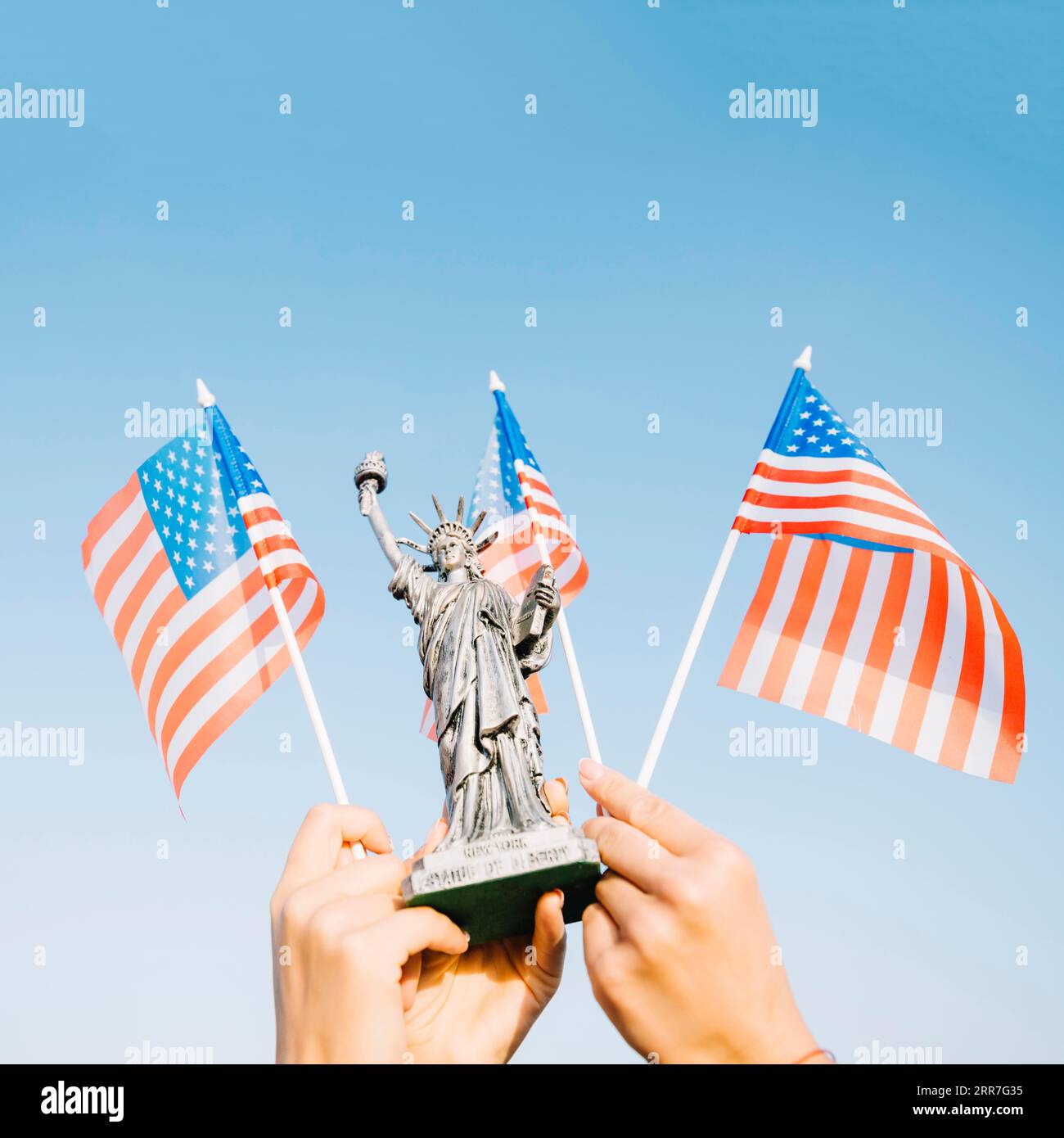 Hands waving american flags Stock Photo - Alamy