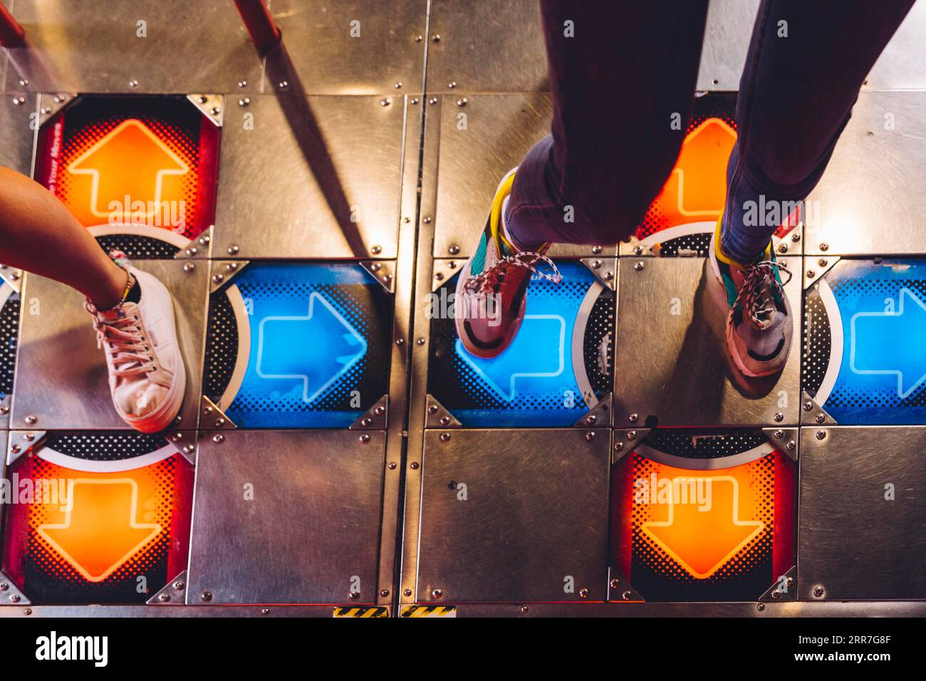 High view women playing dancing arcade Stock Photo - Alamy