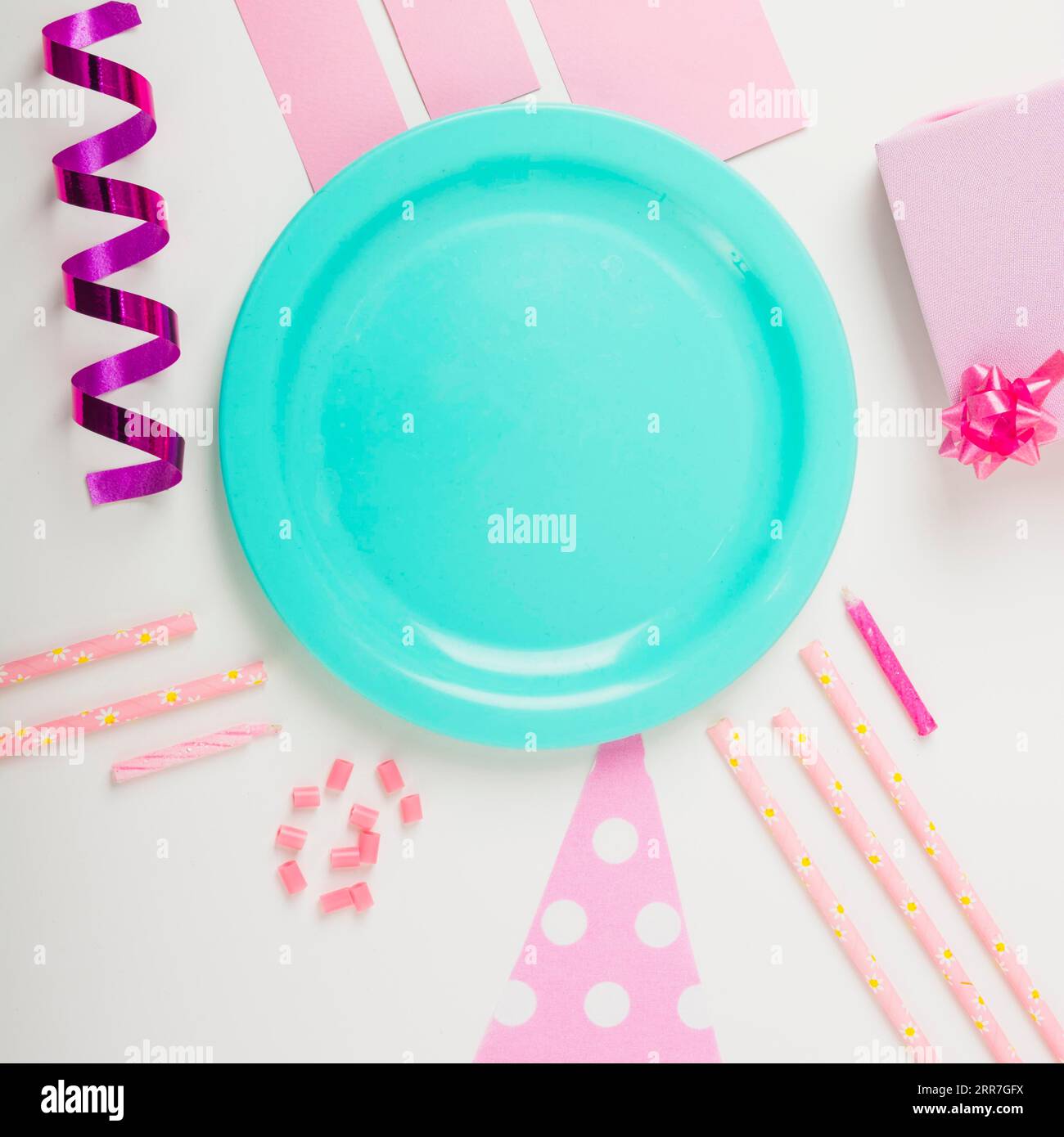 Overhead view plate surrounded with decorative items white backdrop ...