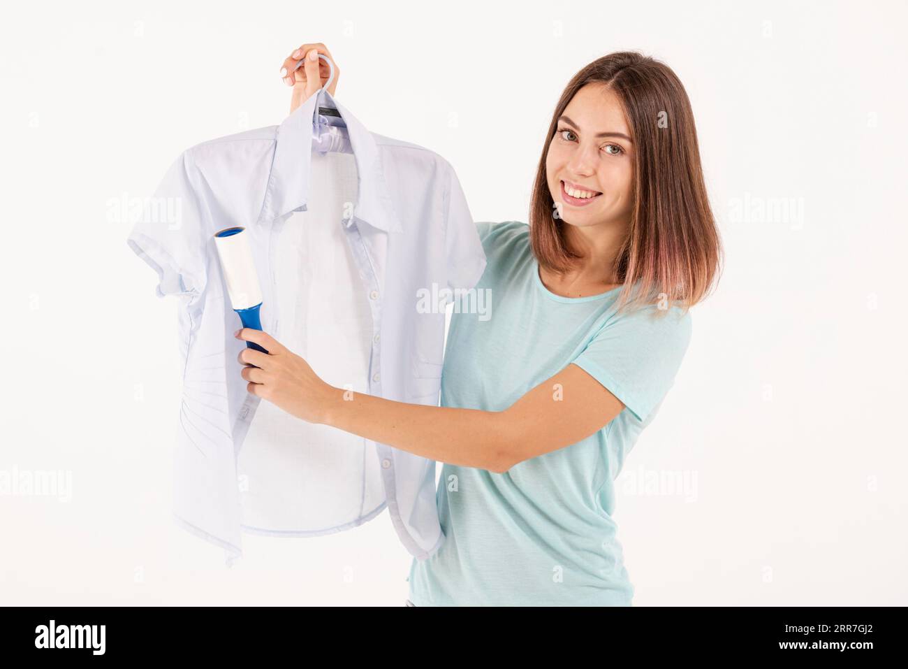 Woman using lint roller hi-res stock photography and images - Alamy
