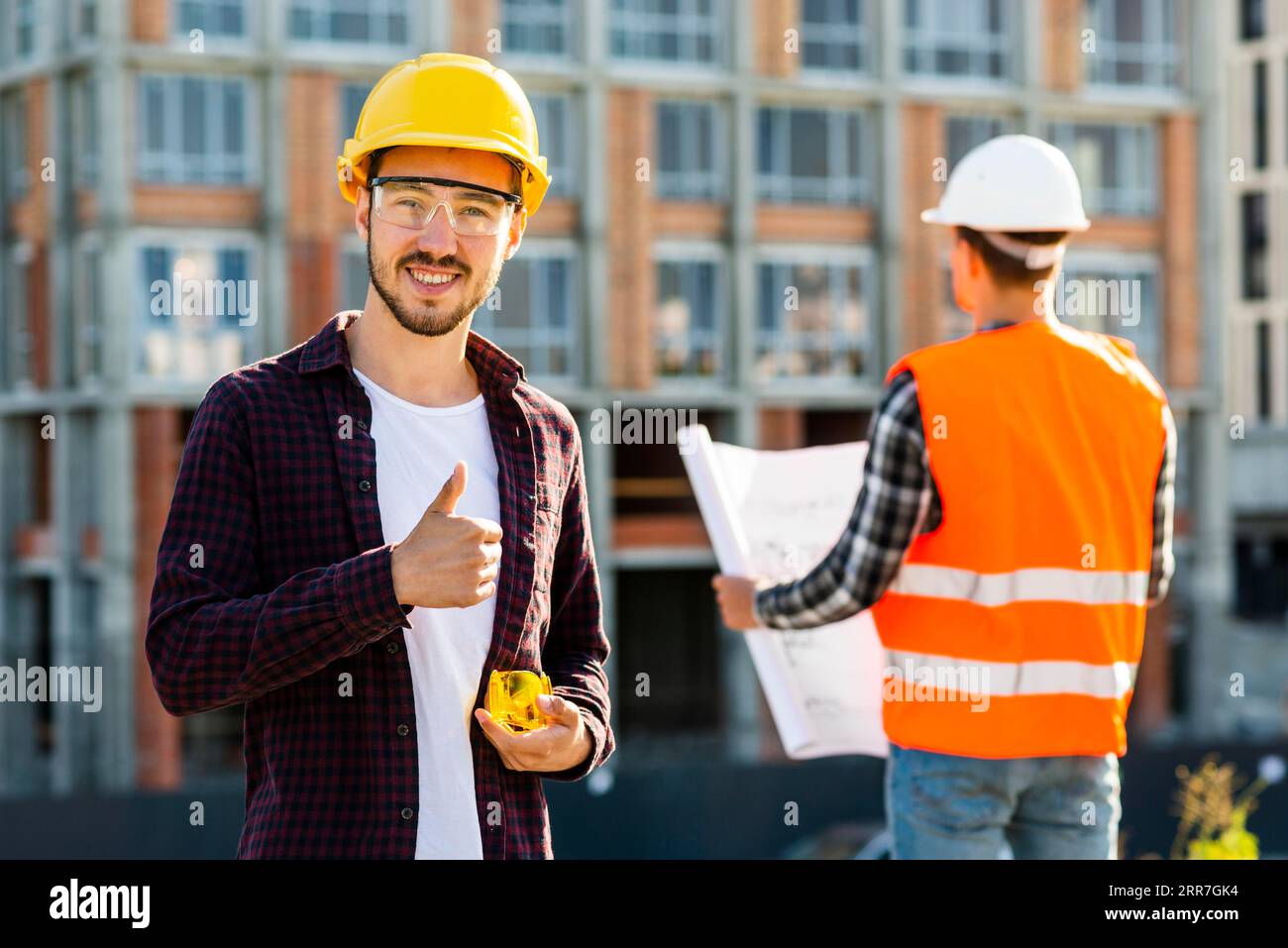 Medium shot portrait smiling architect looking camera Stock Photo - Alamy
