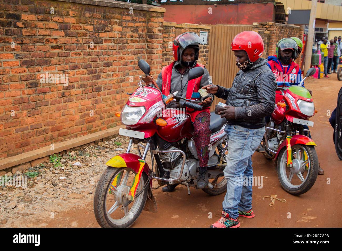 210328 -- KIGALI, March 28, 2021 -- Female moto-taxi rider Claudine ...